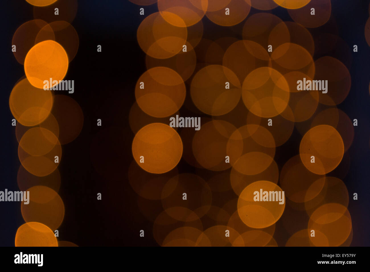 Dazzling orange LED lights with a dark back background using a ...