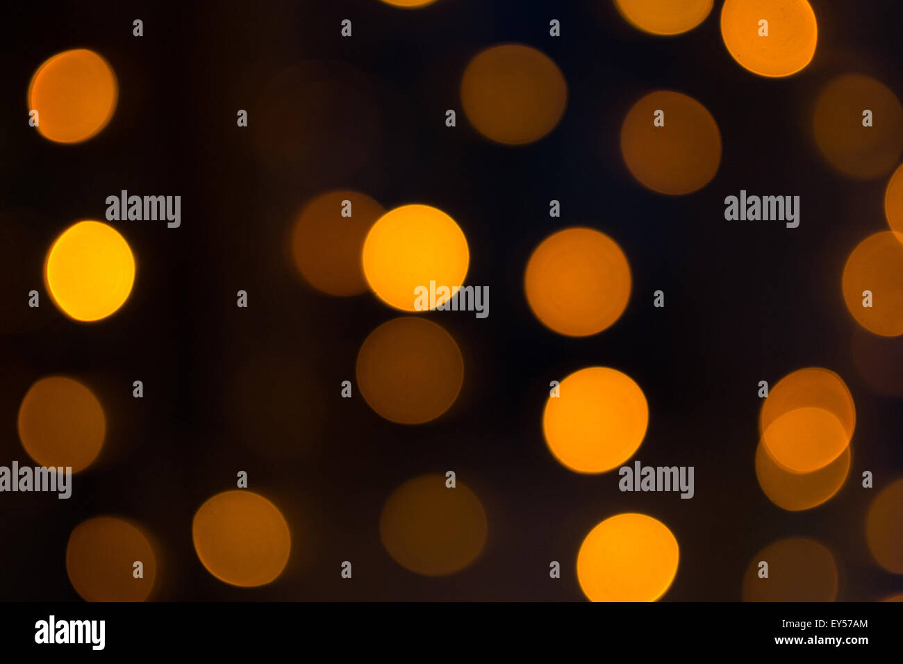 Dazzling orange lights with a dark back background using a defocused ...