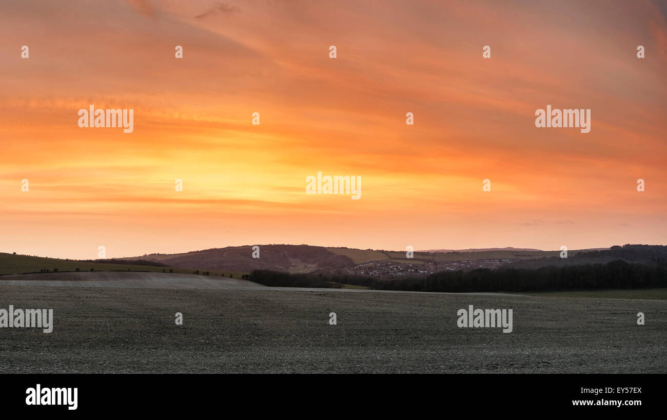 Stunning sunset over farm landscape with vibrant colors Stock Photo - Alamy