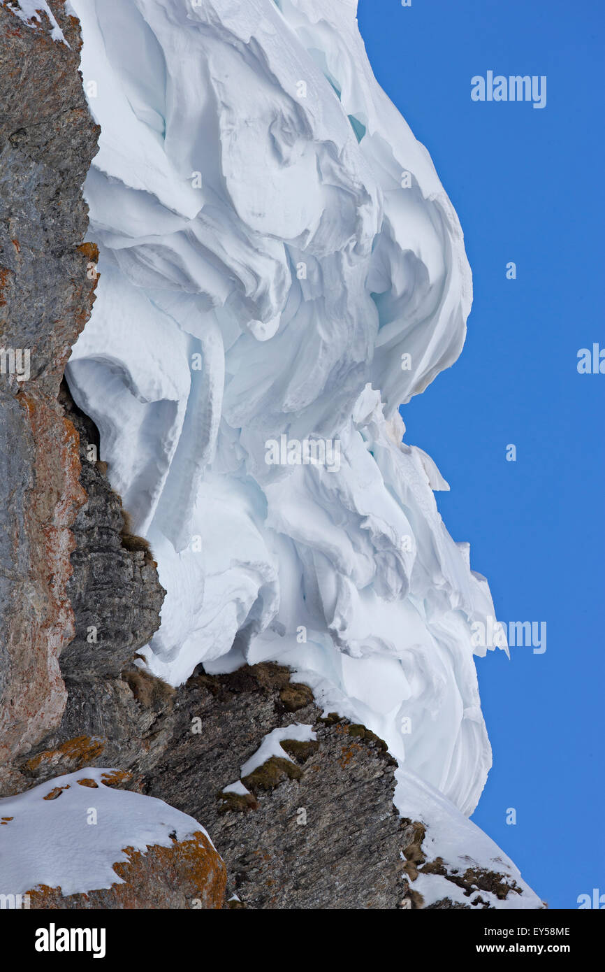 Snowdrift on rock - Swiss Alps Stock Photo - Alamy