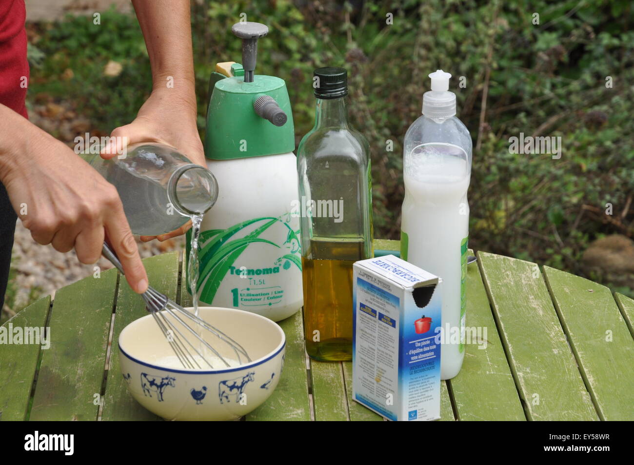 Mixing of a bicarbonate based insecticide in a garden Stock Photo - Alamy