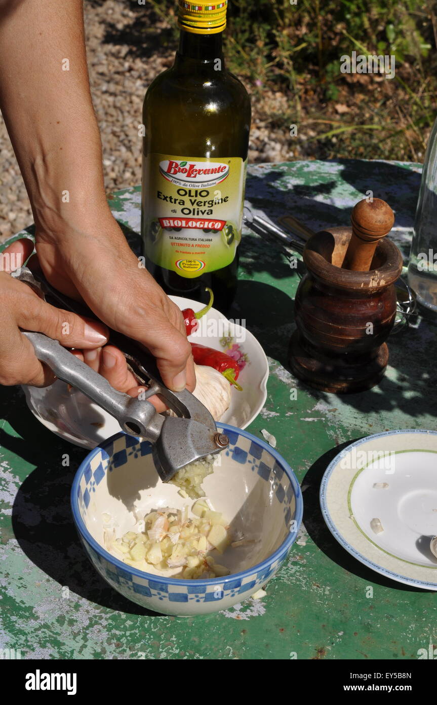 Making of a garlic based natural insecticide Stock Photo - Alamy