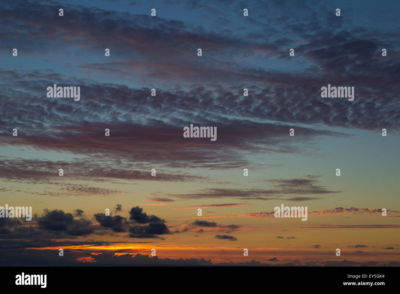 darkening sunset sky with many types of clouds, natural background ...