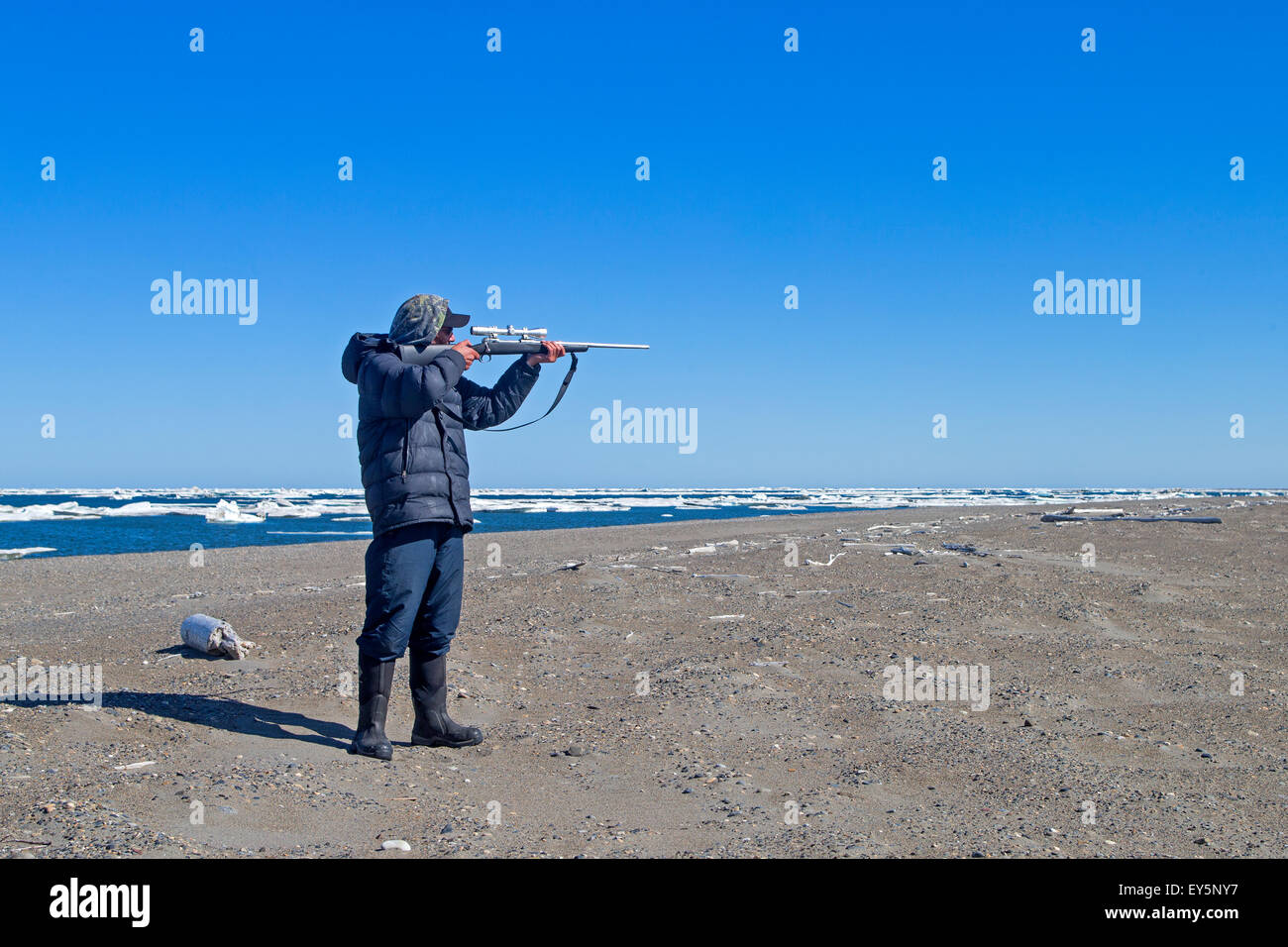 Inupiat hunter with rifle - Barter Island Alaska USA Stock Photo - Alamy