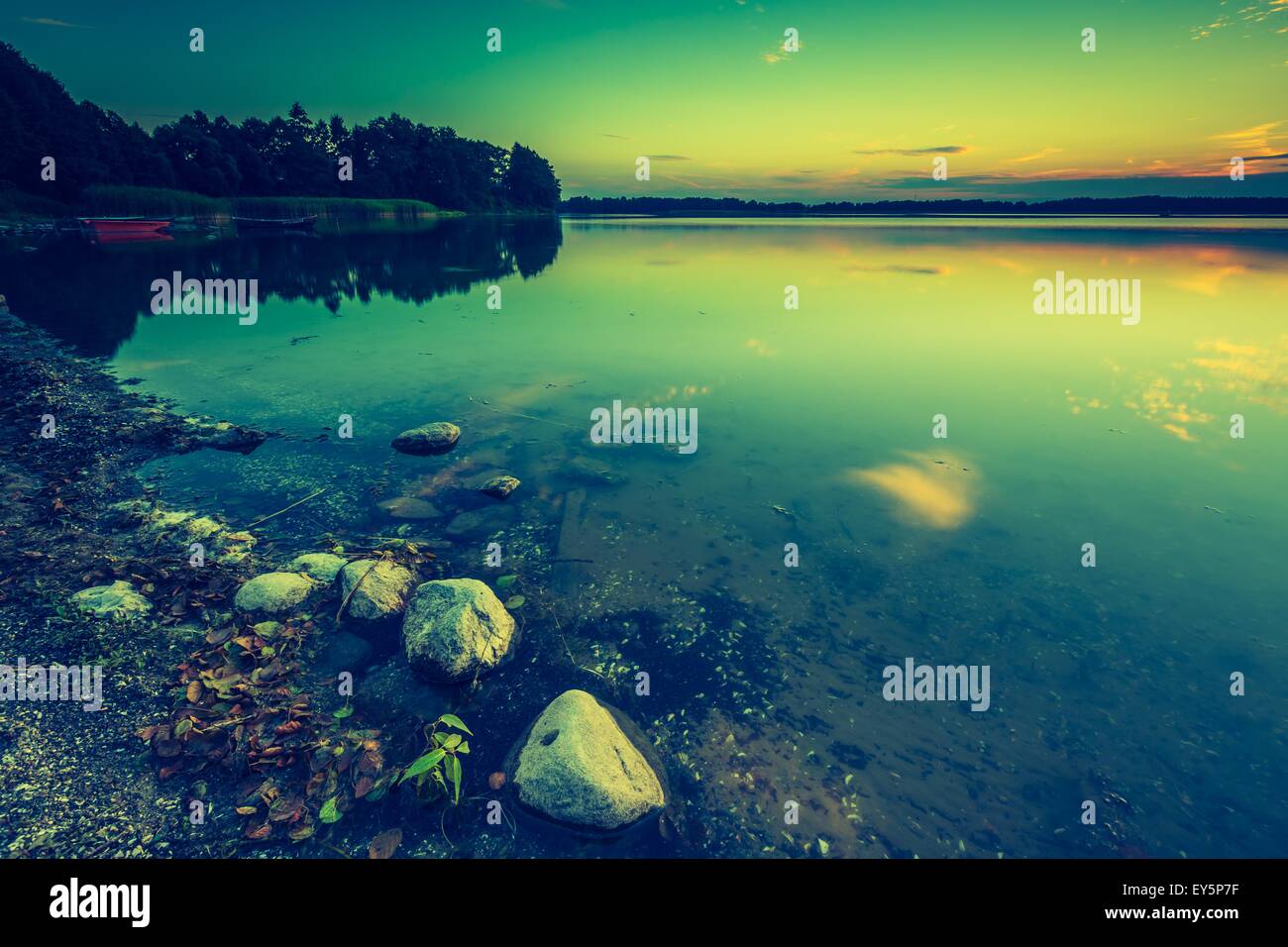 Vintage photo of beautiful lake sunset. Polish lake in Mazury lake ...