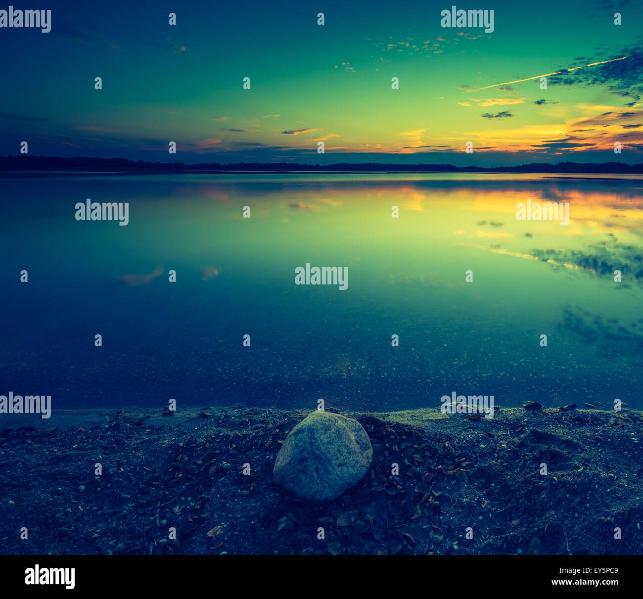 Vintage photo of beautiful lake sunset. Polish lake in Mazury lake ...