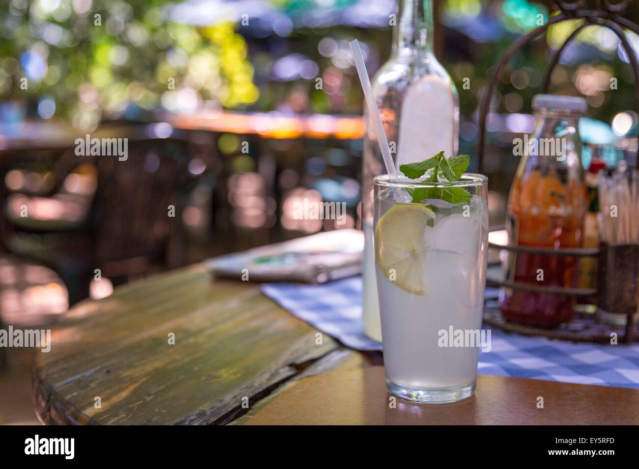 Ice cold lemonade served with mint leaves on a hot summer day under a ...