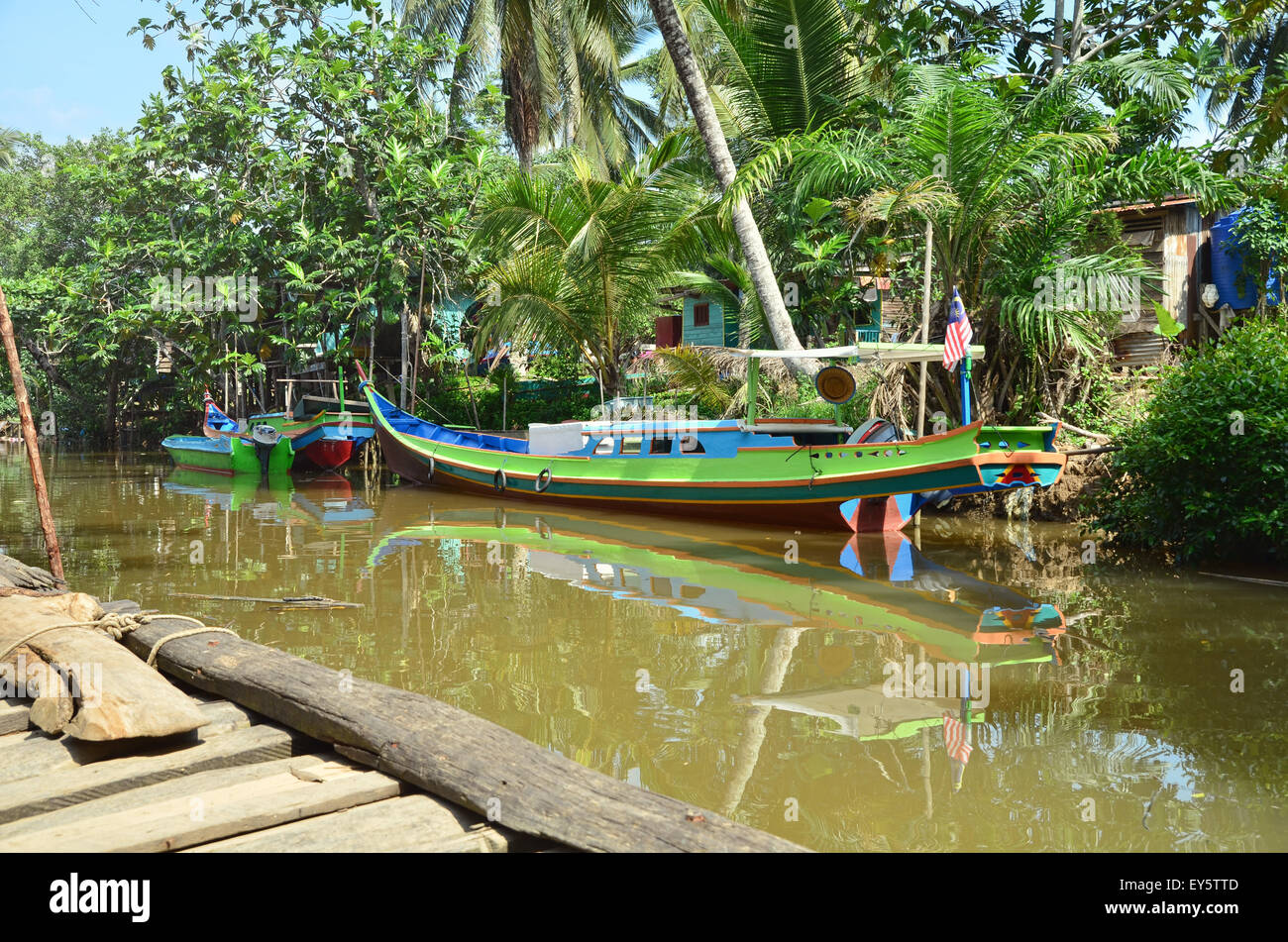 Floating boat on a small river in Sebatik Island Stock Photo - Alamy