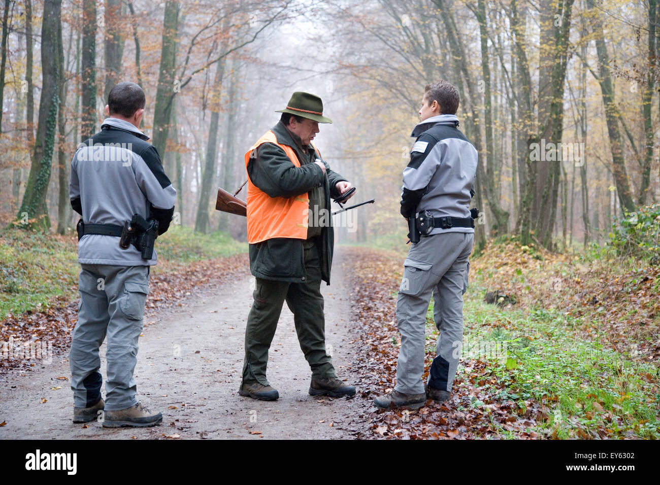 Control of a beaten fighter by the agents of the ONCFS Stock Photo - Alamy