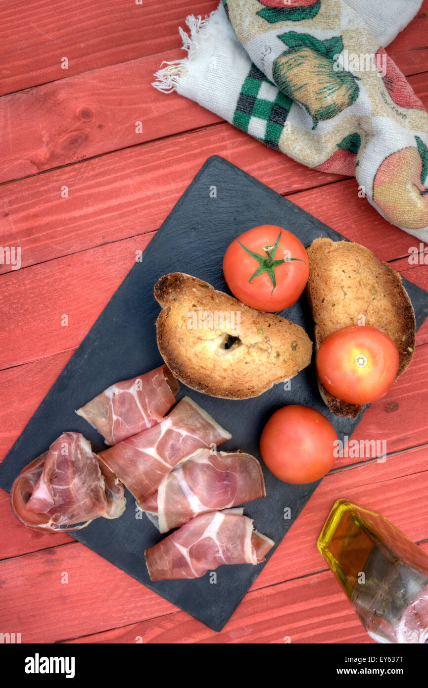 a vertical overhead view of a traditional mediterranean dish, pan ...