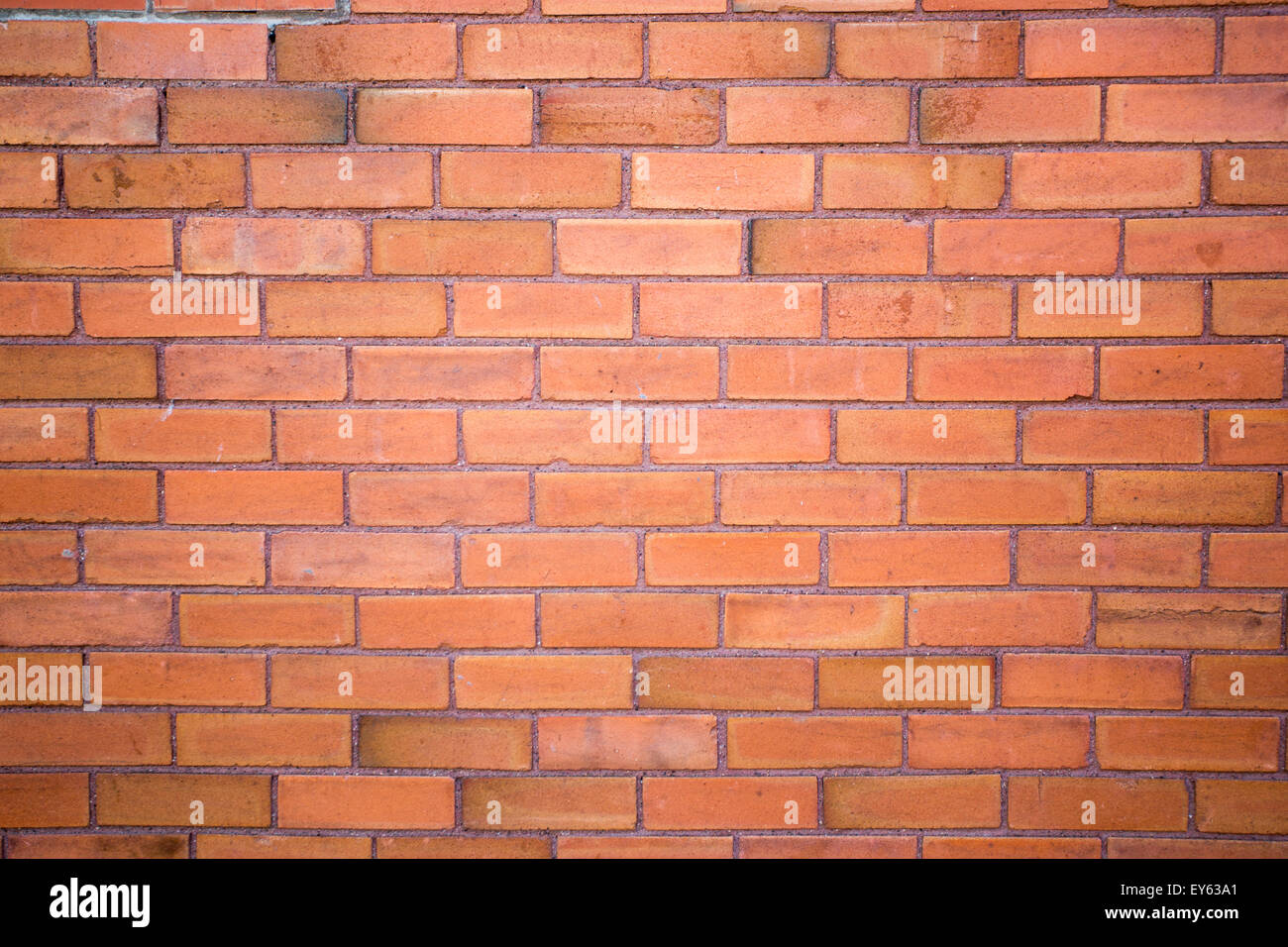 Brick wall background on building structure Stock Photo - Alamy