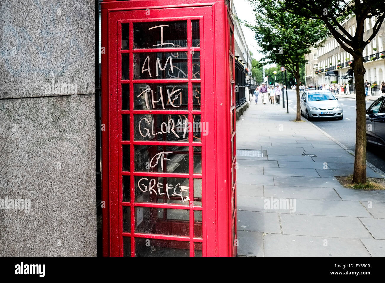 Graffiti scrawled on a traditional red telephone box Stock Photo - Alamy
