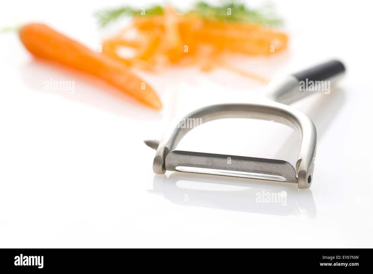 Peeler and carrot Stock Photo - Alamy
