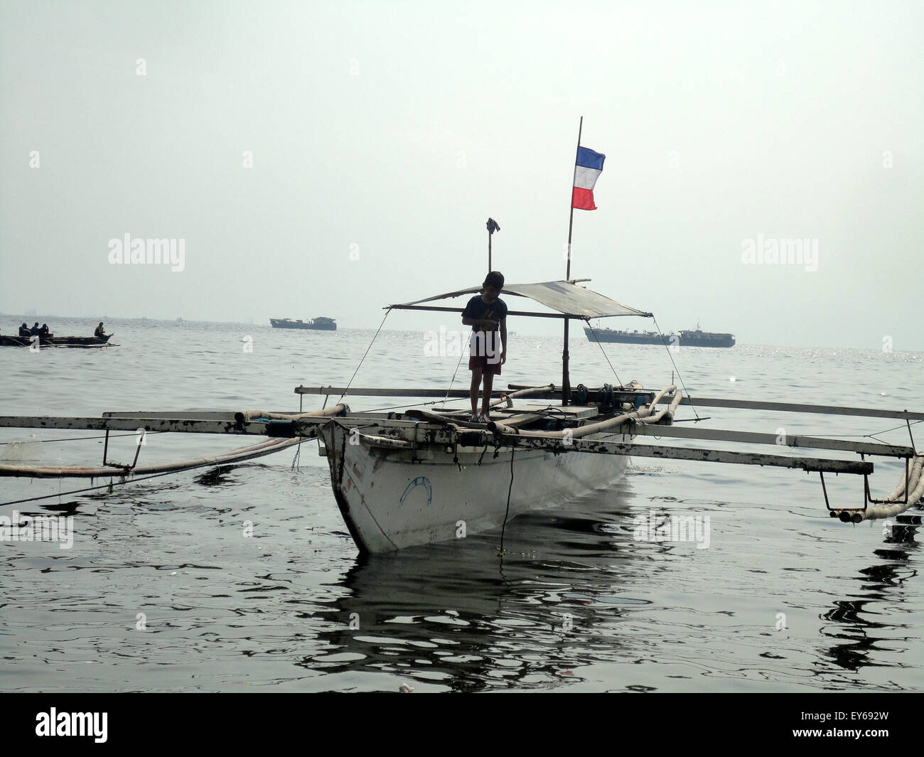 Navotas City, Philippines. 22nd July, 2015. A Filipino child plays on a ...