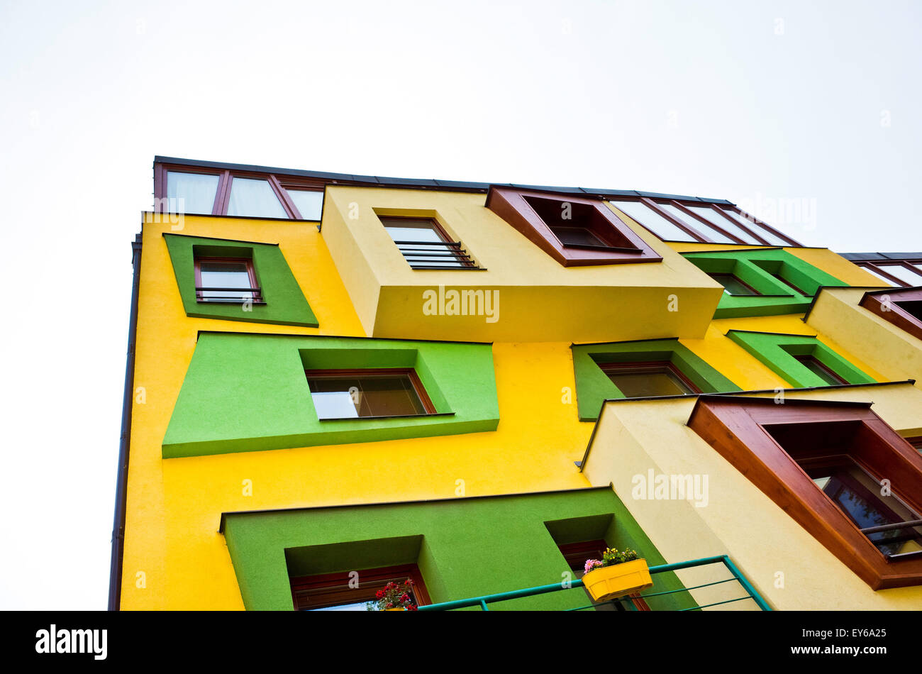 modern building in yellow walls and green windows Stock Photo - Alamy