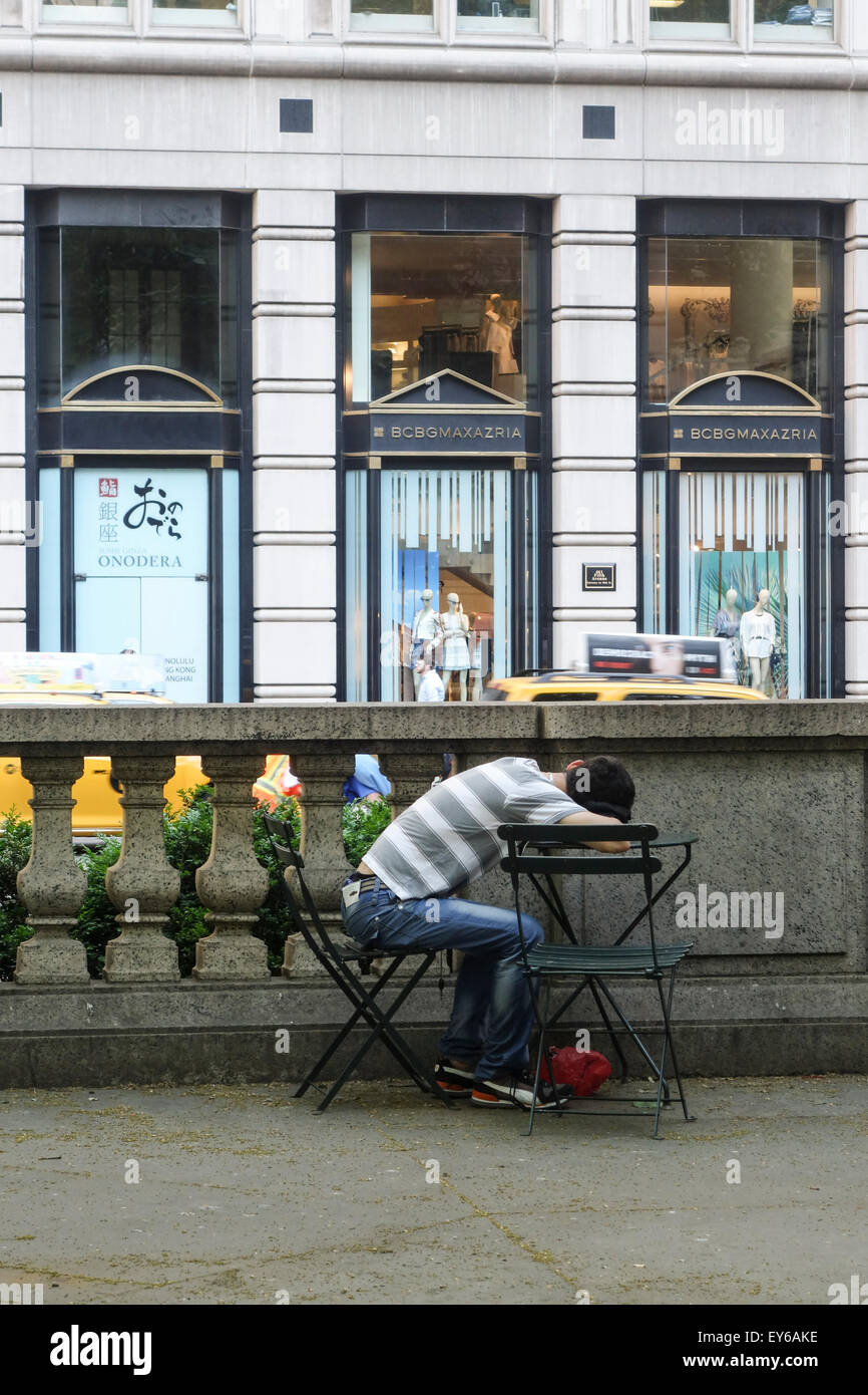 Young man sleeping during lunch time in front of New York Public ...