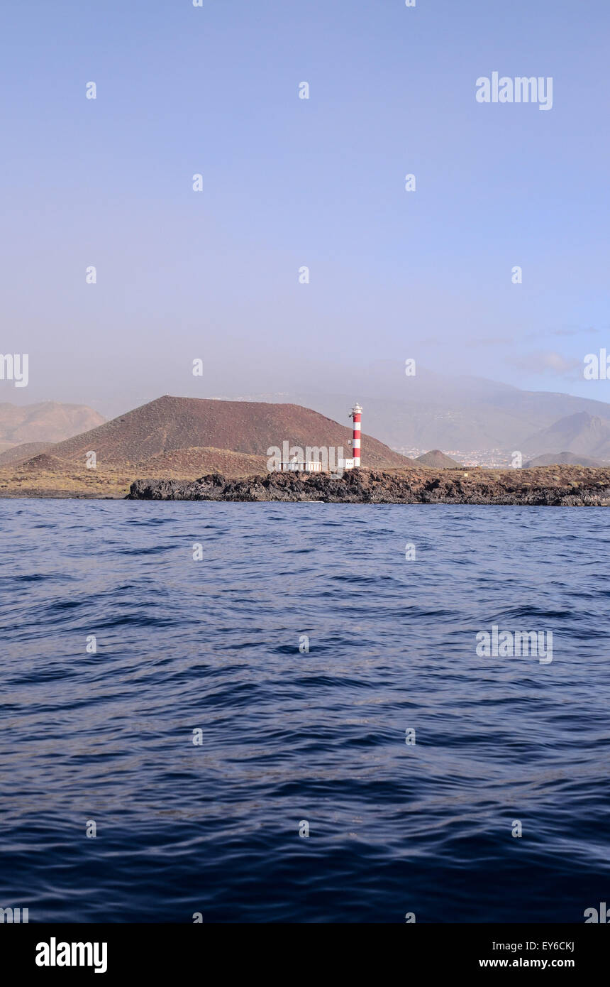 High Lighthouse near the Coast Stock Photo - Alamy
