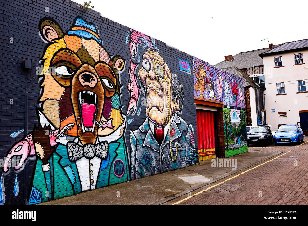 Graffiti art on a wall in Sunderland, UK depicts a bear and a man Stock ...