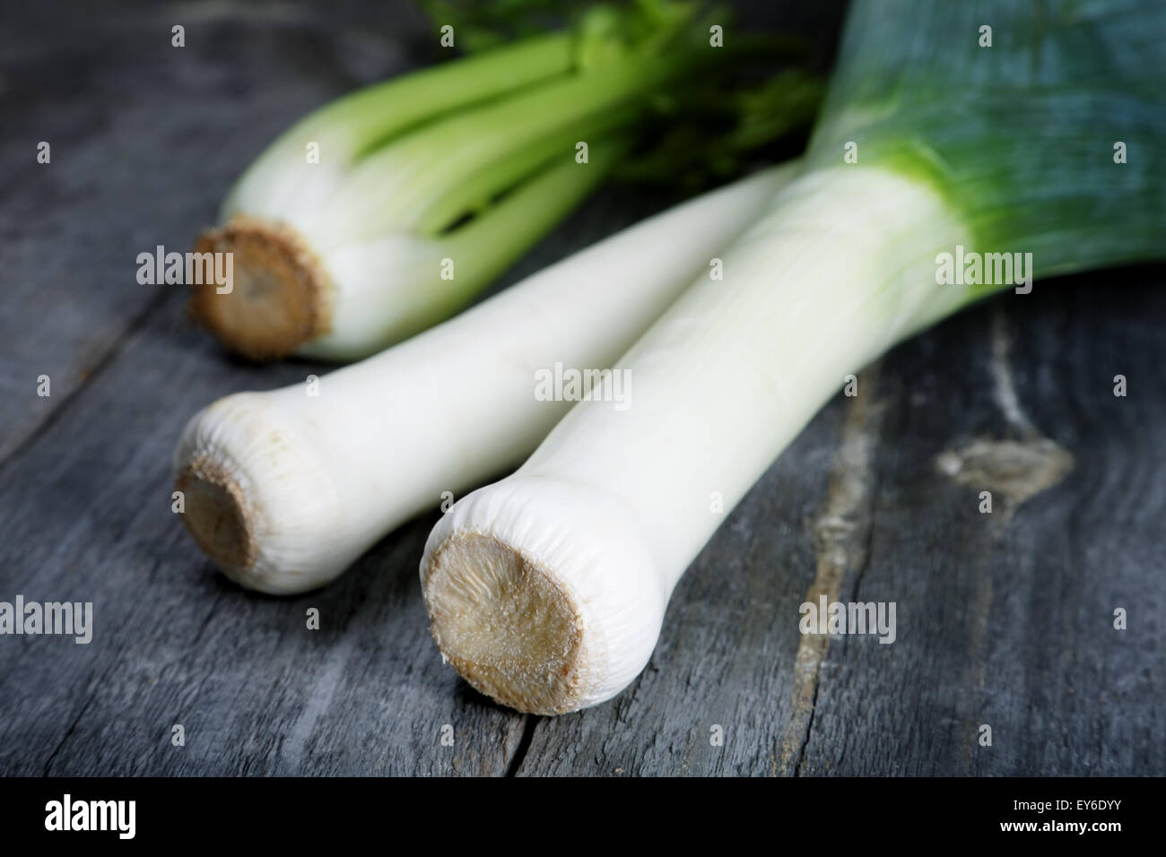 large shallot stalks on a rustic table Stock Photo - Alamy