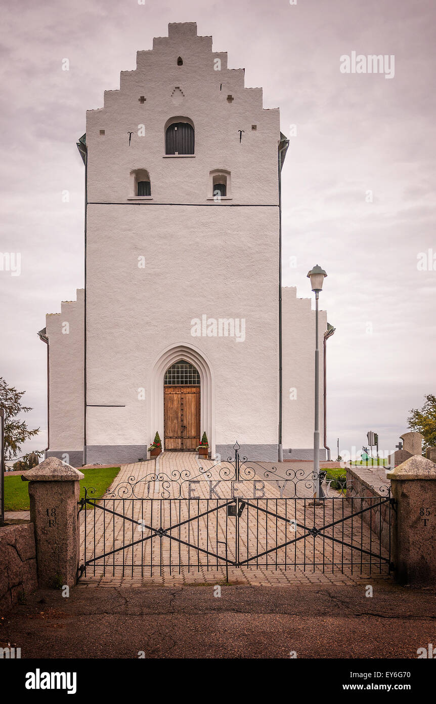 An image of an old white church in the swedish village of Ekeby Stock ...