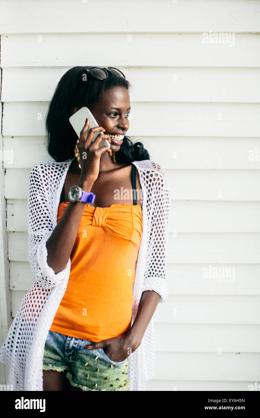 Young african woman with mobile phone Stock Photo - Alamy