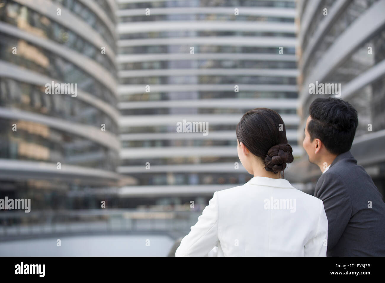 Business person looking at view Stock Photo - Alamy