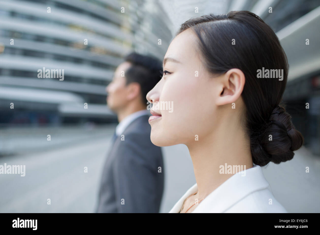 Business person looking at view Stock Photo - Alamy