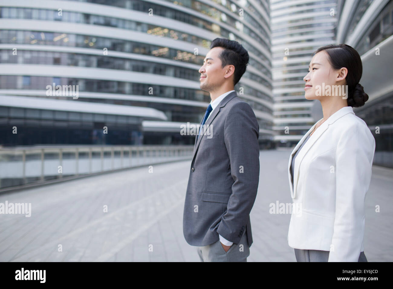 Business person looking at view Stock Photo - Alamy
