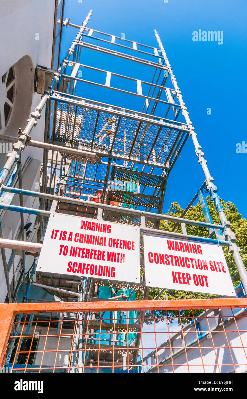 Scaffolding and warning signs at a building site Stock Photo - Alamy