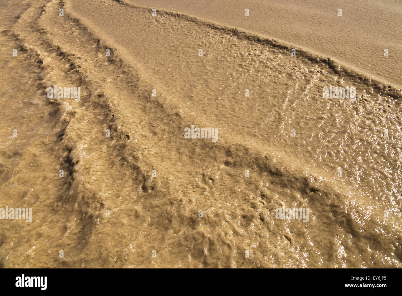 Waves and ripples on a beach in South Africa Stock Photo - Alamy