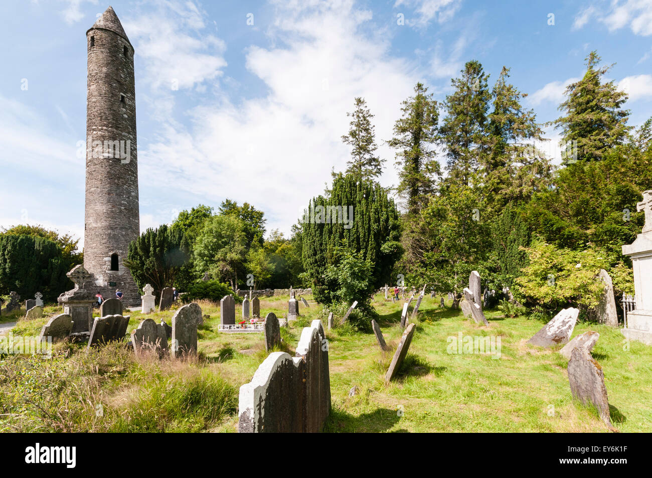 Ancient monastic Roundtower at Glendalough Graveyard, Ireland Stock ...
