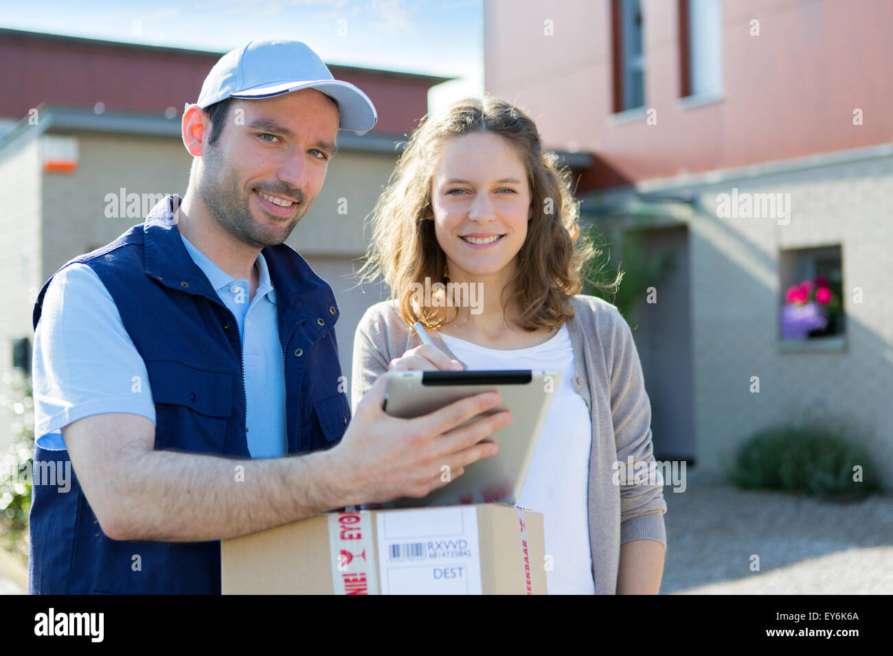 Signing for a parcel hi-res stock photography and images - Alamy