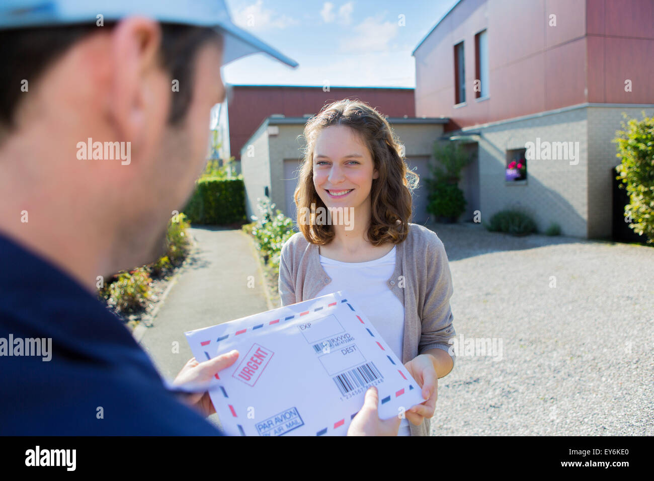 Man handing letter woman in hi-res stock photography and images - Alamy