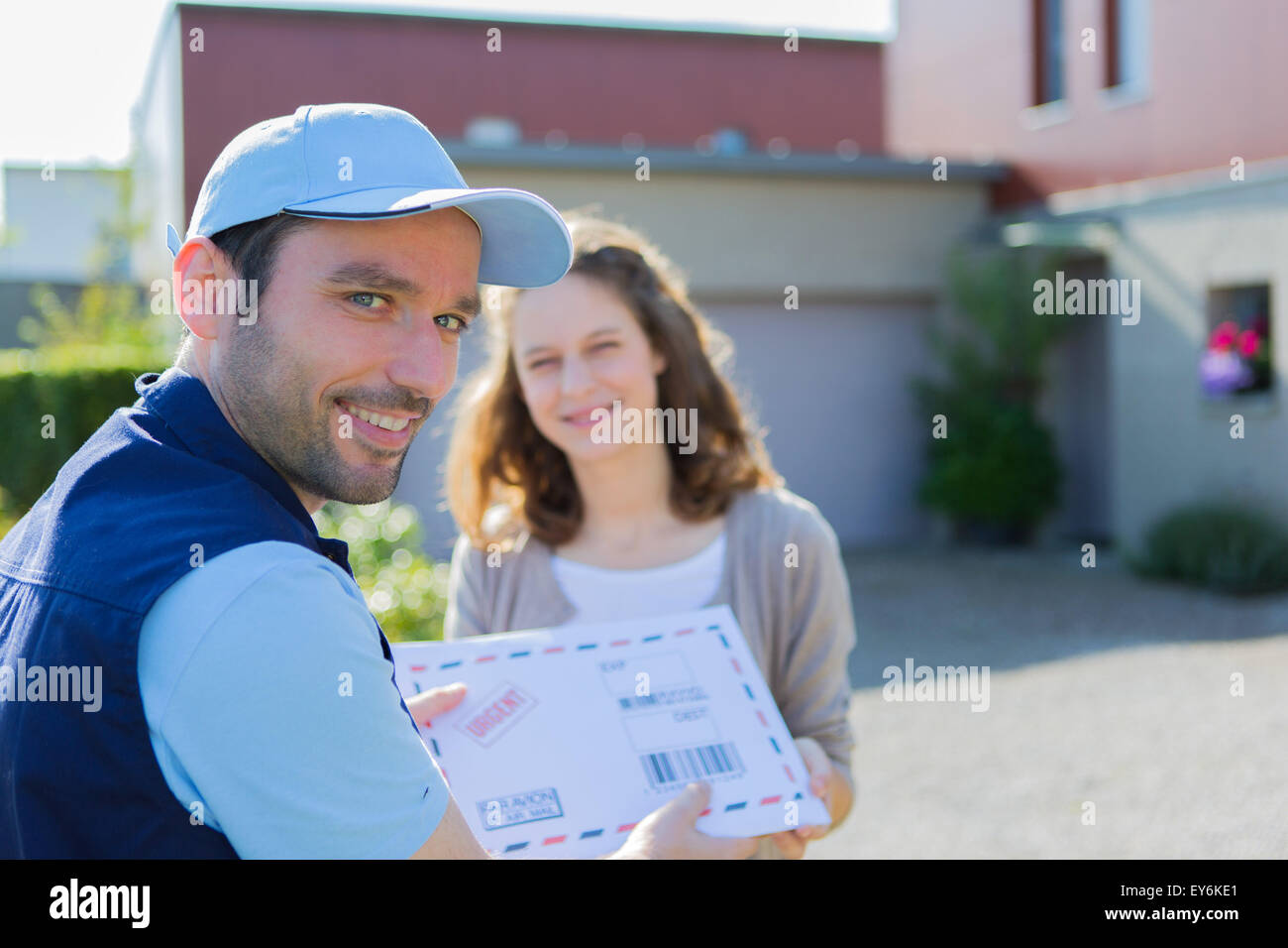 Man handing letter woman in hi-res stock photography and images - Alamy