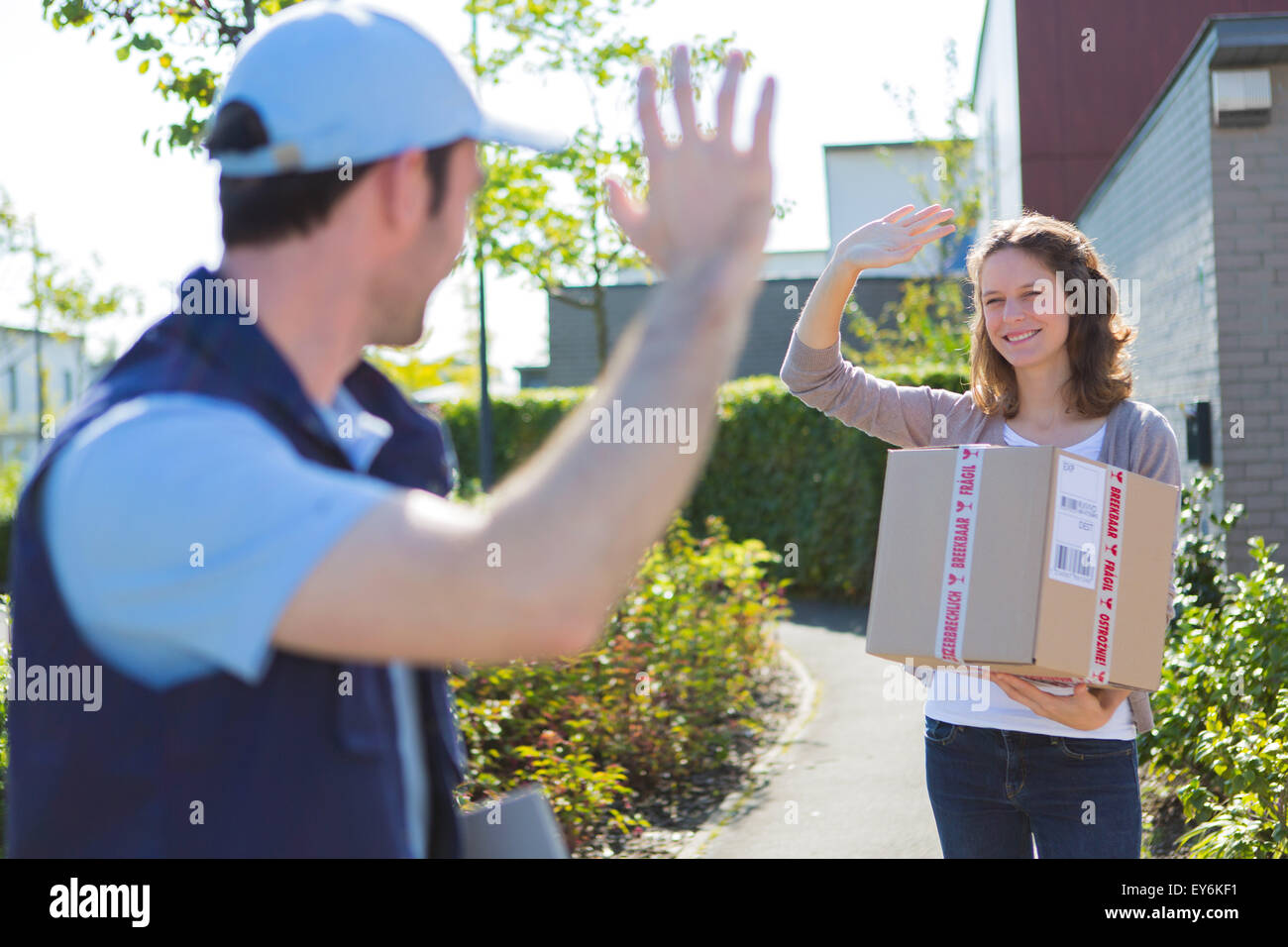 View of a Delivery man succeed during his delivery Stock Photo - Alamy