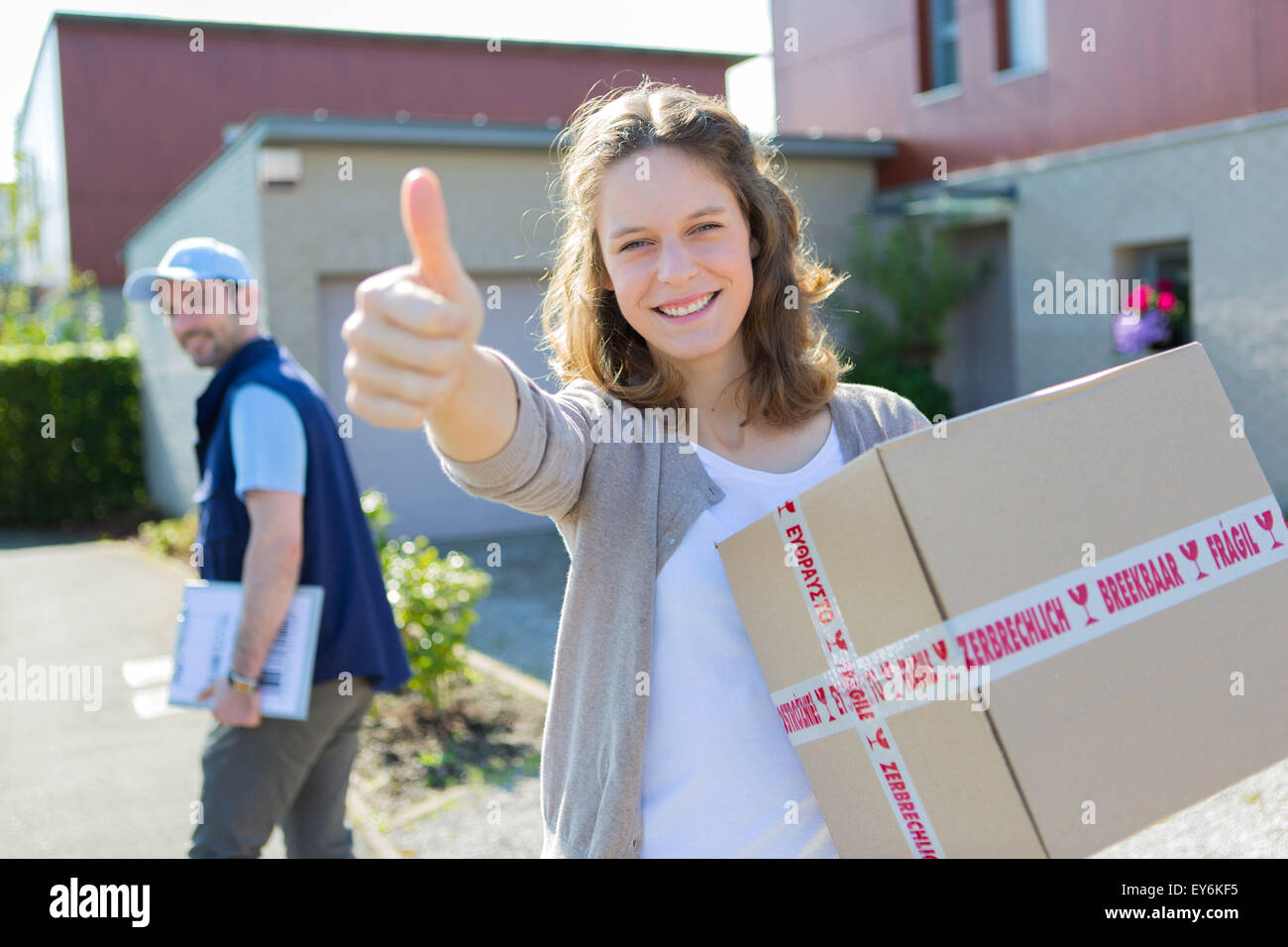; woman;happy,parcel,delivery; man;; package; parcel; deliver; big ...
