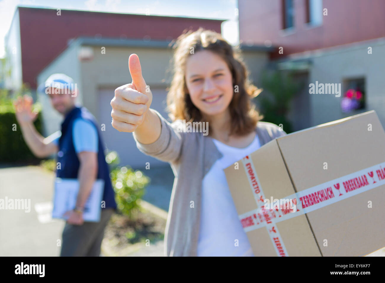 ; woman;happy,parcel,delivery; man;; package; parcel; deliver; big ...