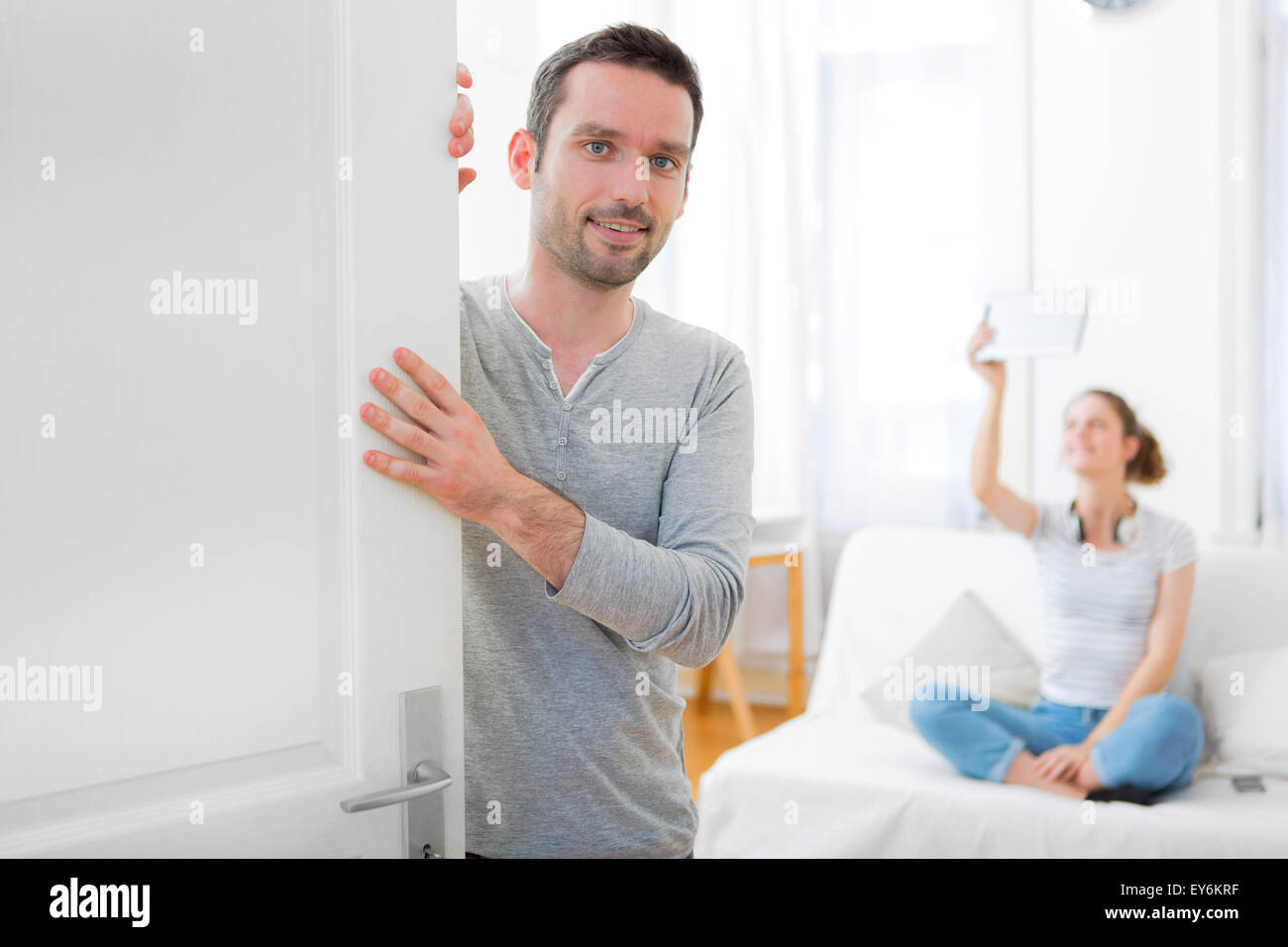 Woman welcoming man in hi-res stock photography and images - Alamy