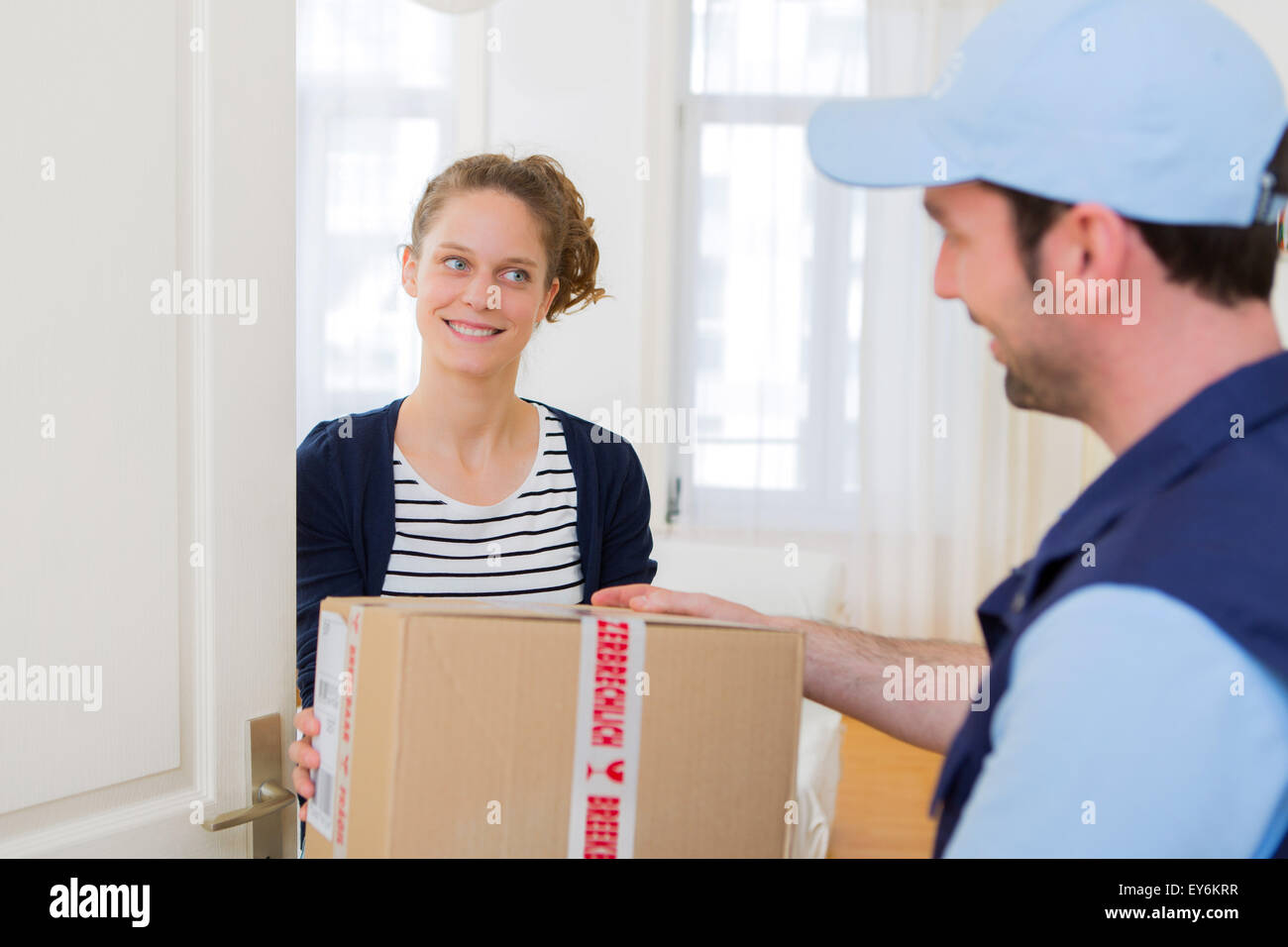 Handing parcel hi-res stock photography and images - Alamy