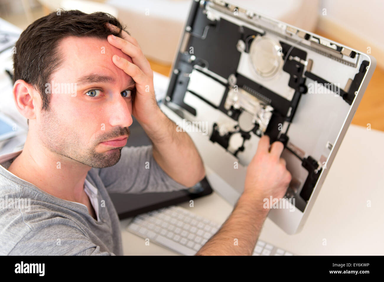 Man repairing computer hi-res stock photography and images - Alamy