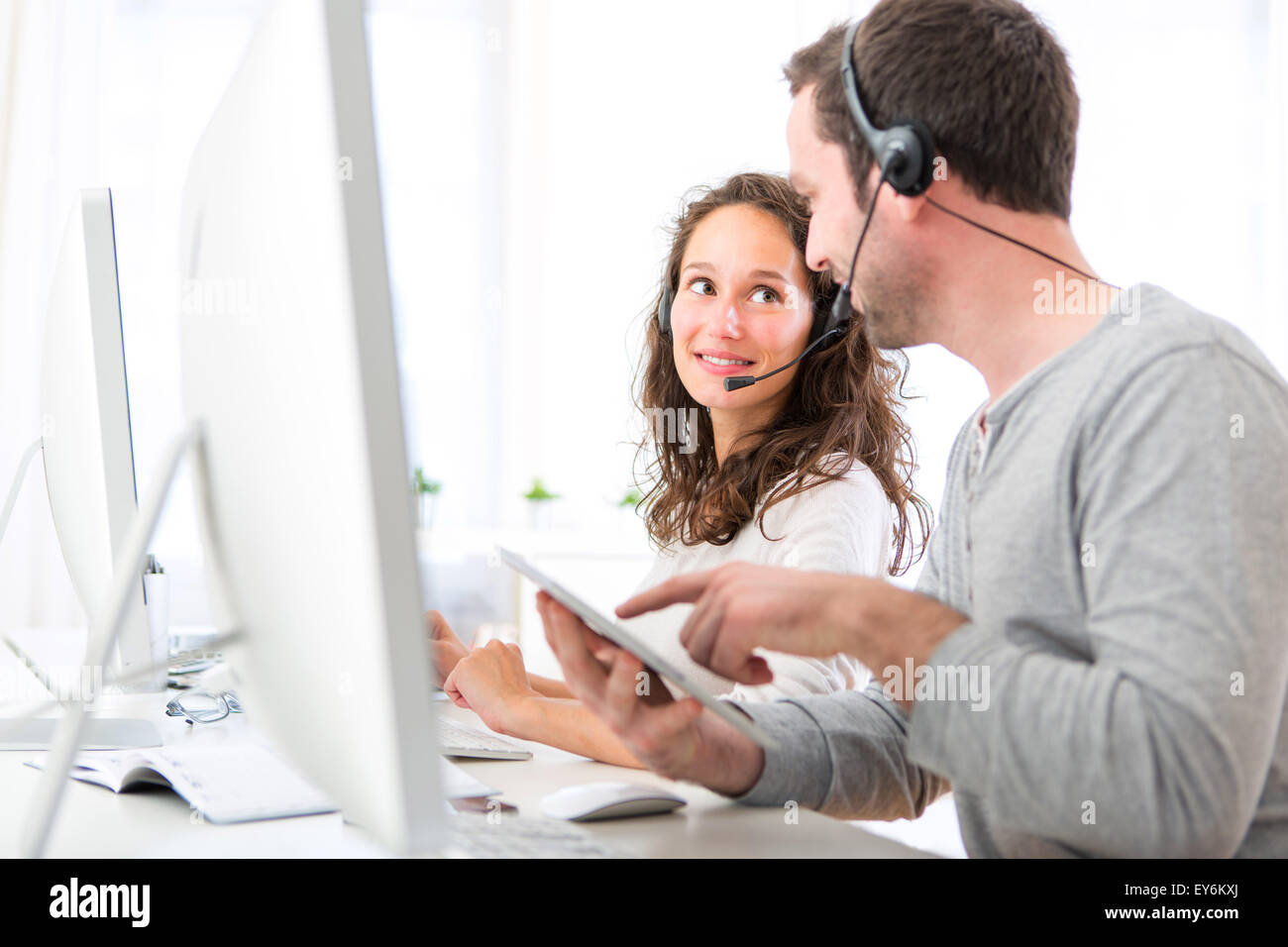 View of Co-workers on a call center having fun Stock Photo - Alamy