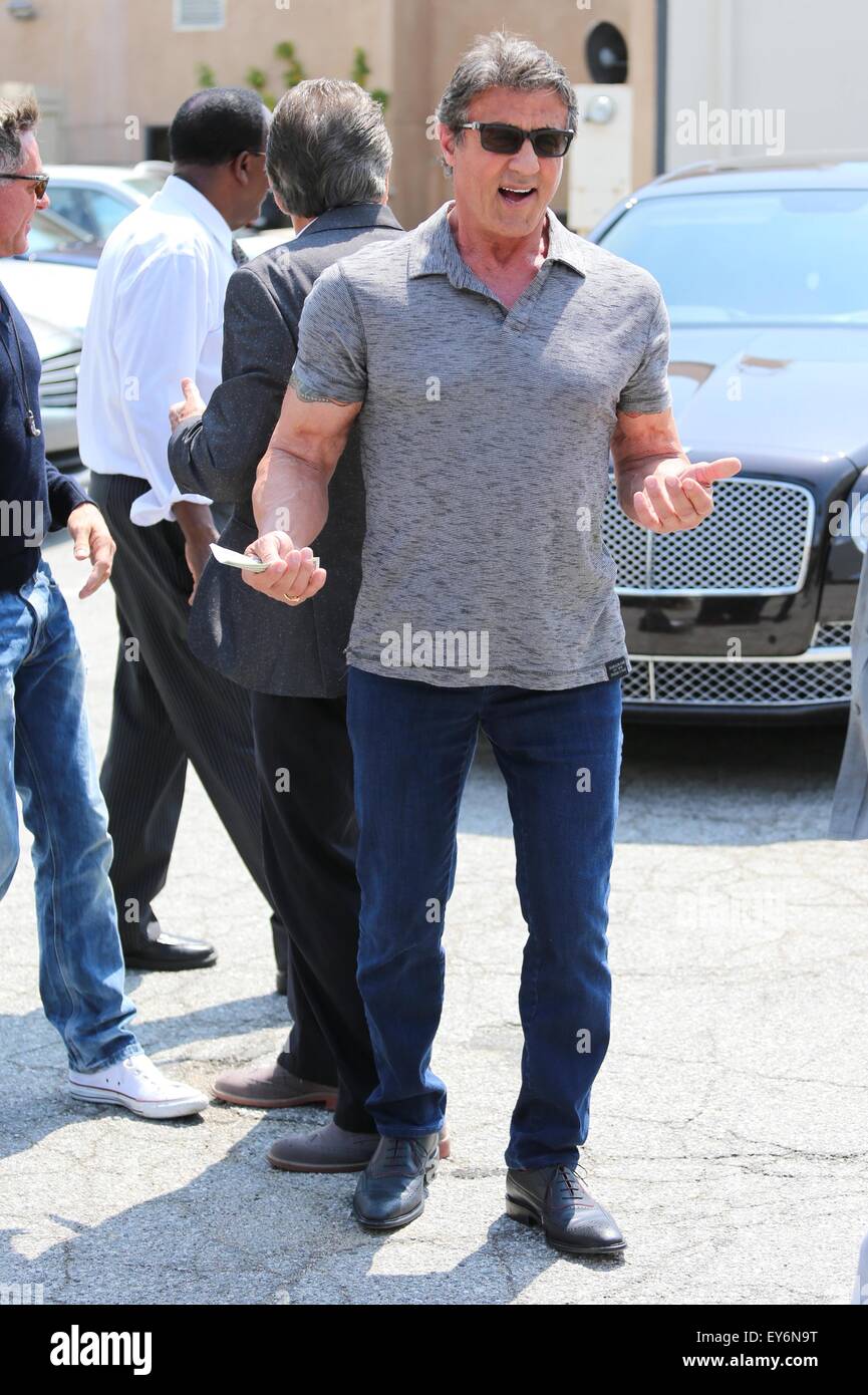 Sylvester Stallone exits Cafe Roma with money in his hand Featuring ...
