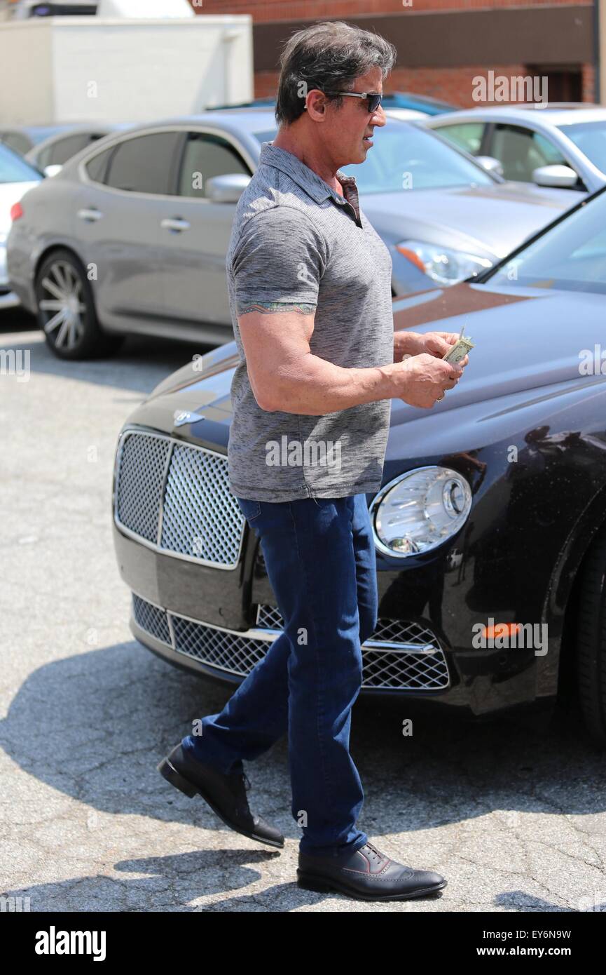 Sylvester Stallone exits Cafe Roma with money in his hand Featuring ...