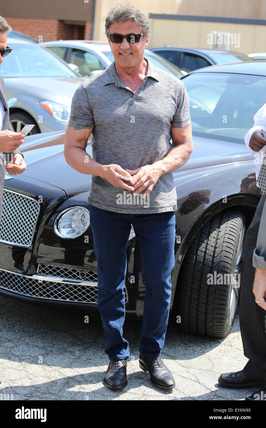 Sylvester Stallone exits Cafe Roma with money in his hand Featuring ...