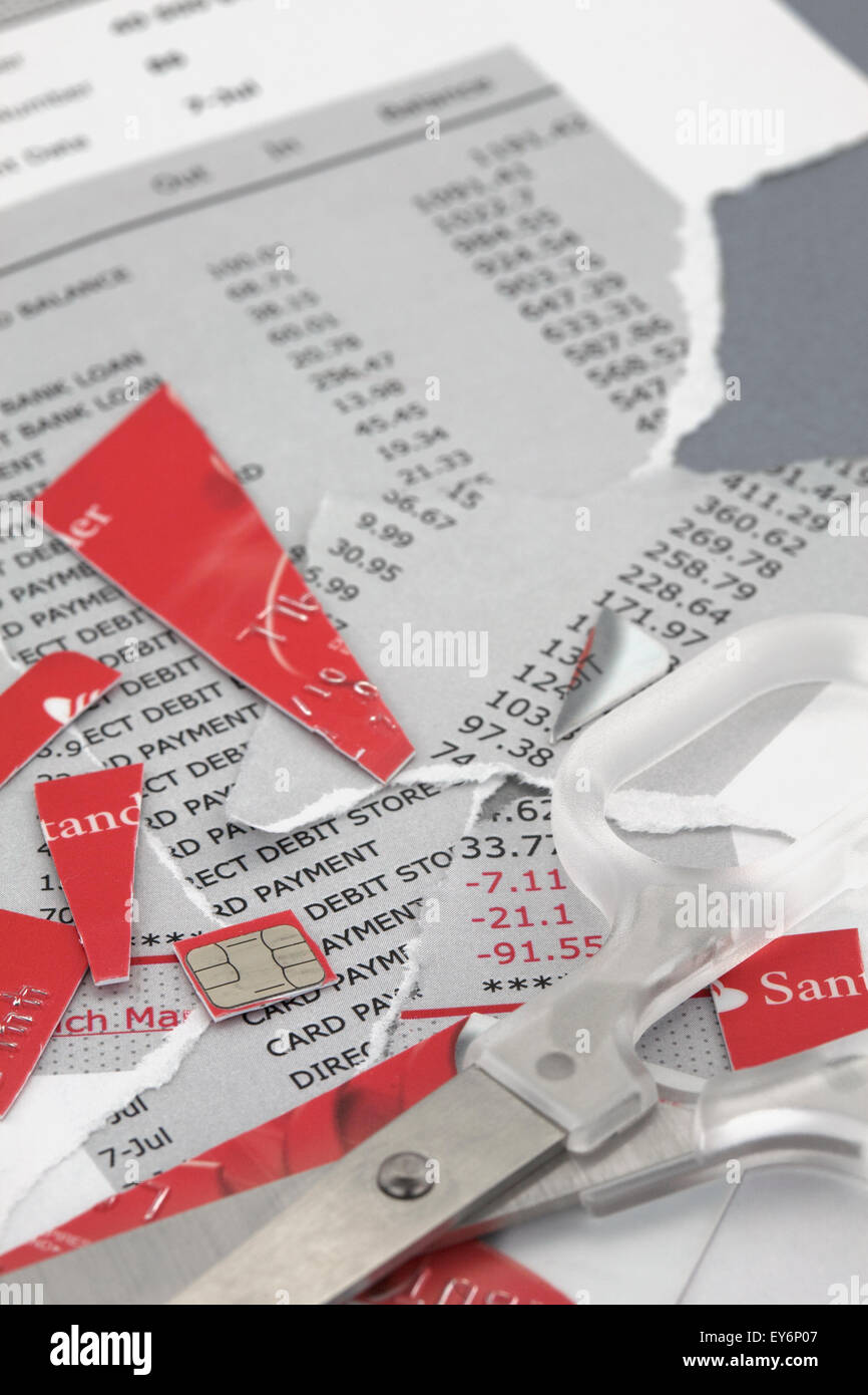 a pair of scissors on Torn Bank statements and cut up Credit Cards ...