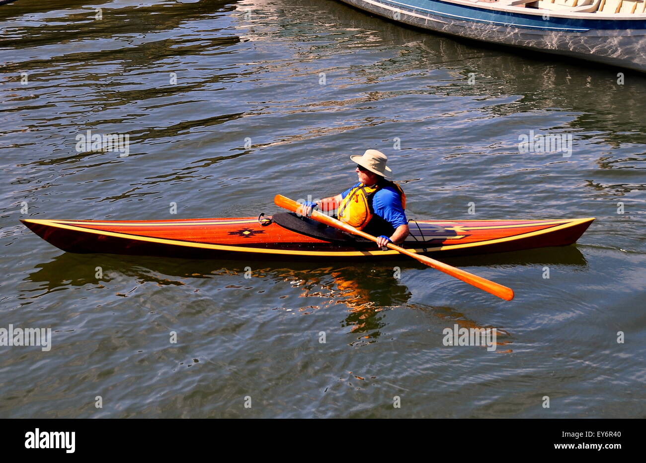 Mystic, Connecticut: Man paddling a kayak in the tranquil waters of the ...
