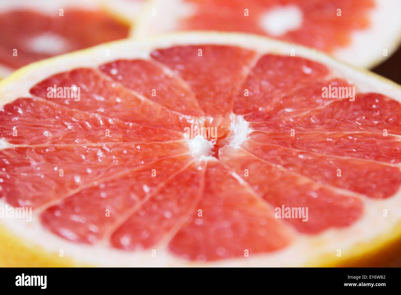 grapefruit bright red and cut by segments Stock Photo - Alamy