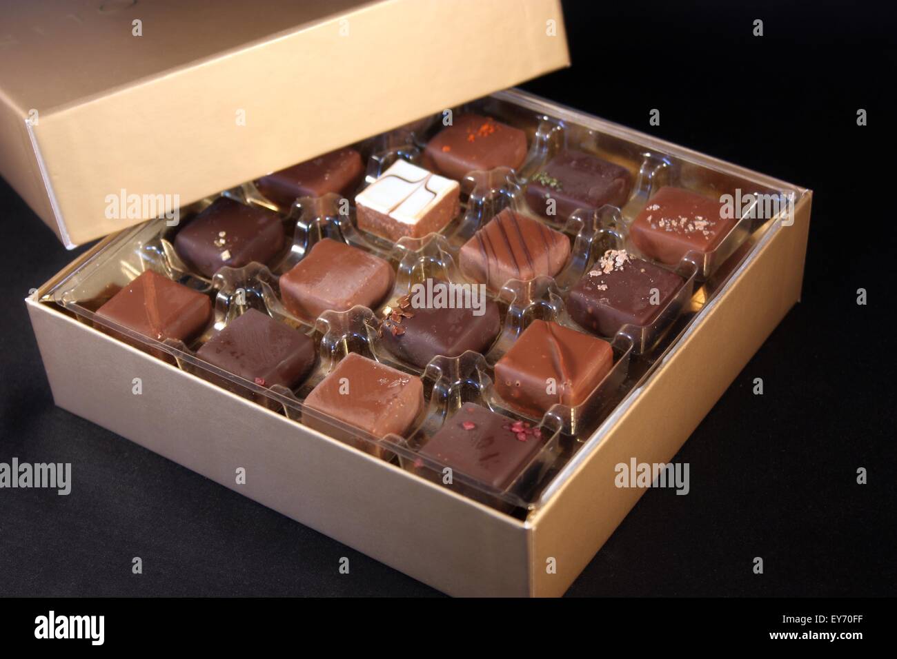 Open box with chocolate candies Stock Photo - Alamy