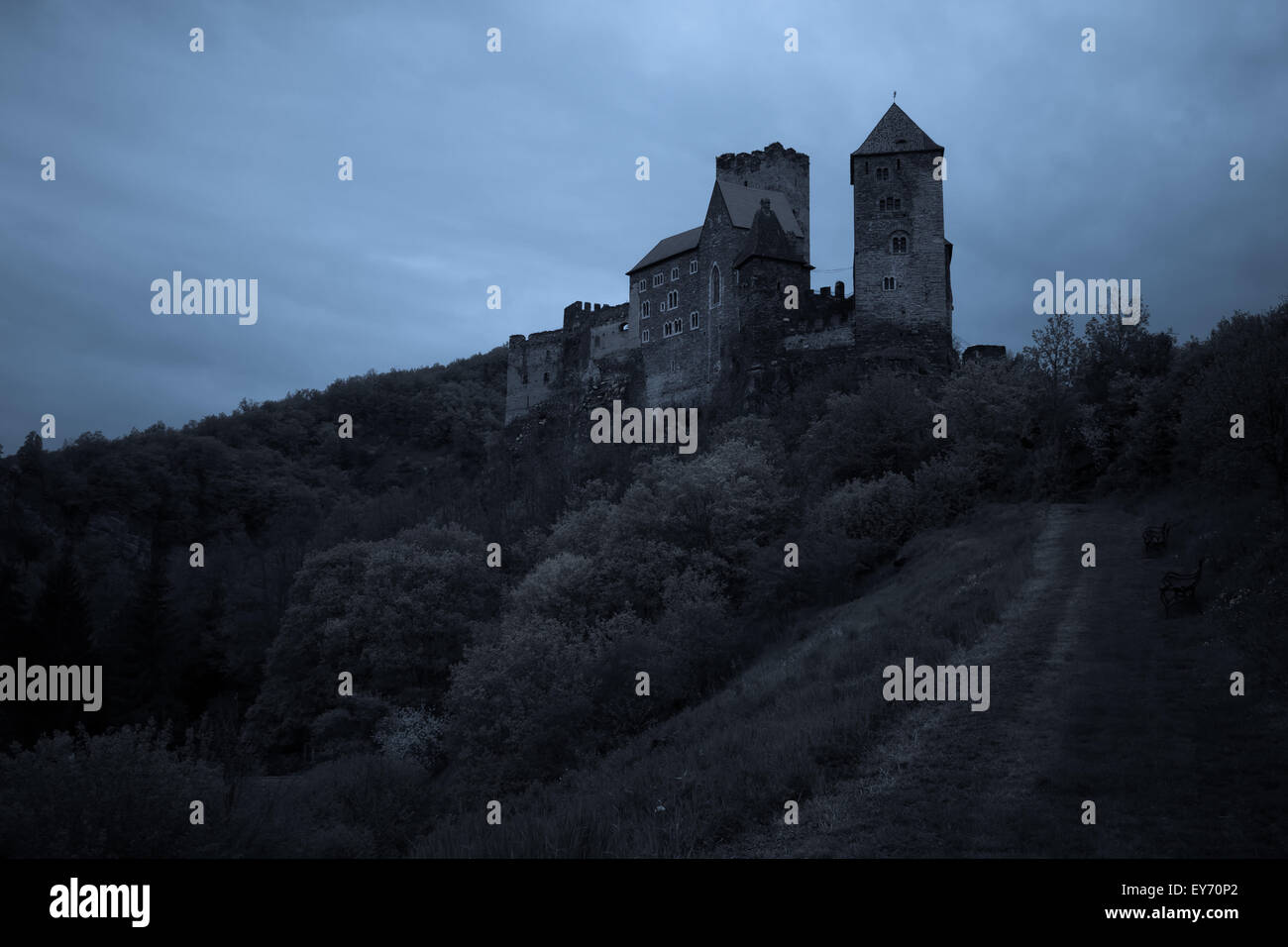 Medieval castle at night with stormy sky Stock Photo - Alamy