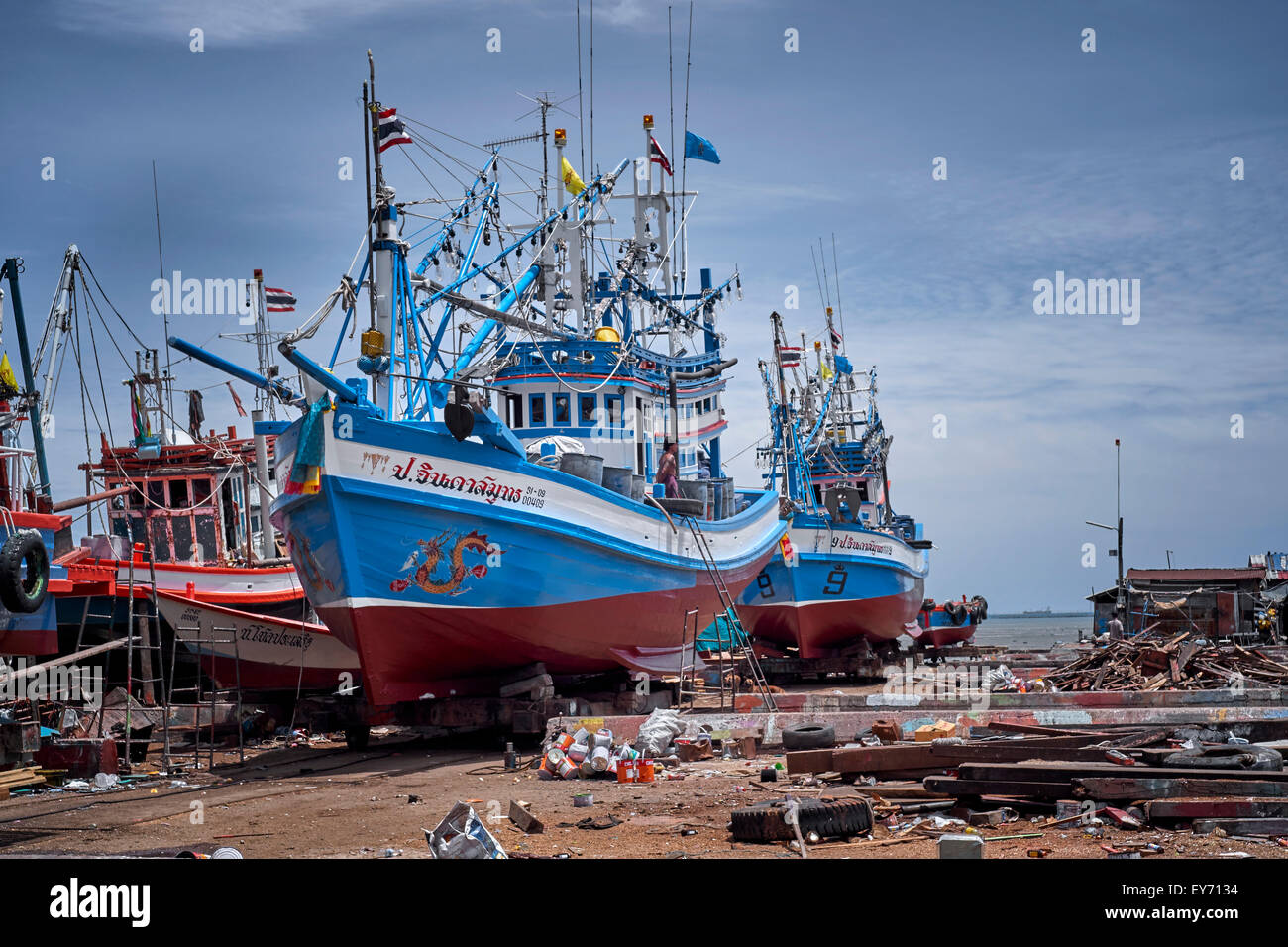 Thailand commercial fishing boats undergoing renovation at a boat yard ...